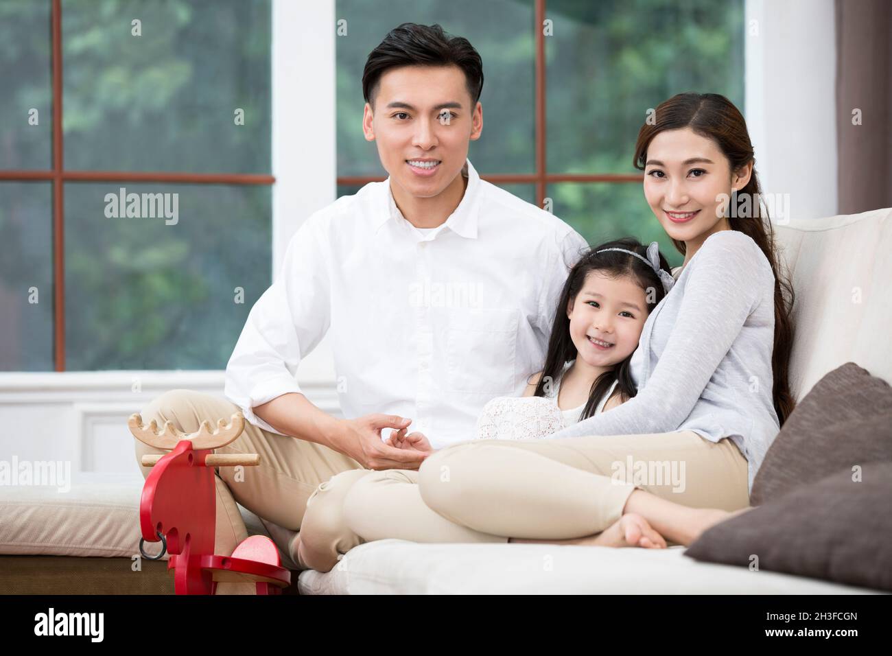 Warm and loving family of three Stock Photo - Alamy