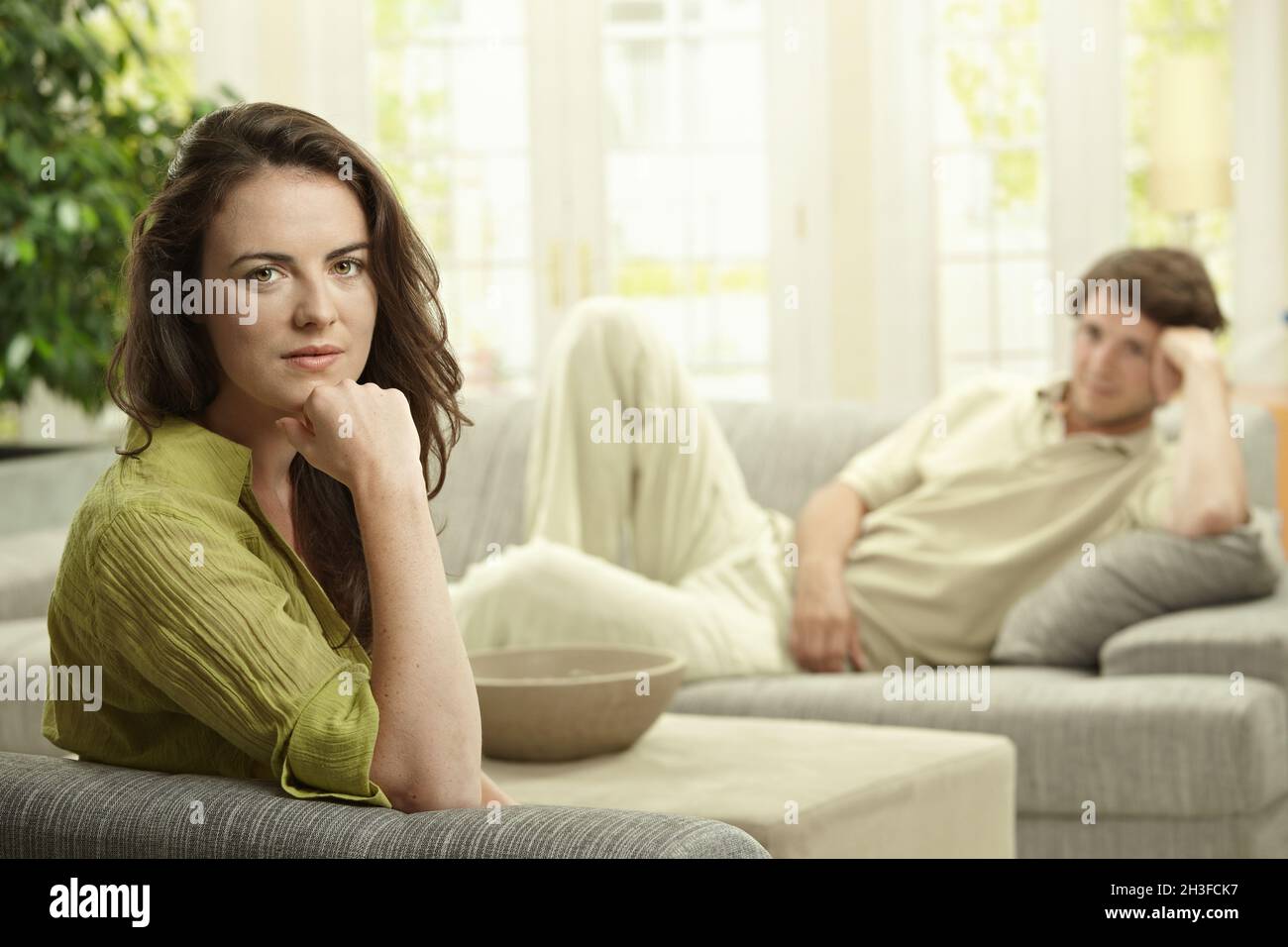 Couple resting at home Stock Photo - Alamy