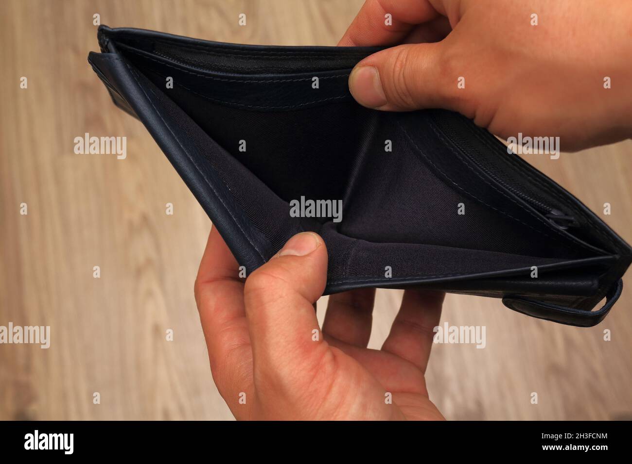 Poor man hand open empty wallet looking for money, broke, bankrupt or crisis concept Stock Photo ...