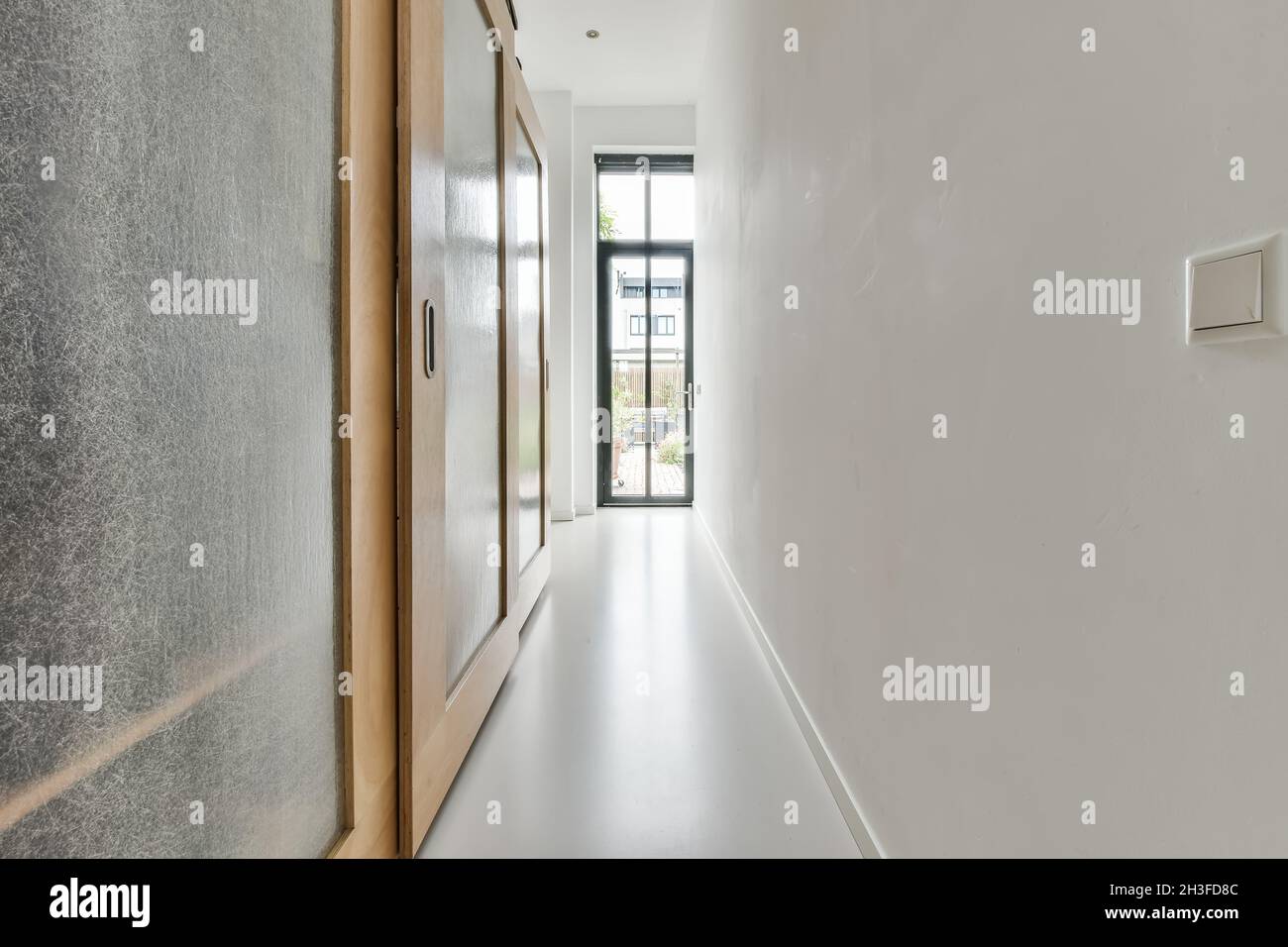Long empty corridor designed in minimalistic style Stock Photo - Alamy
