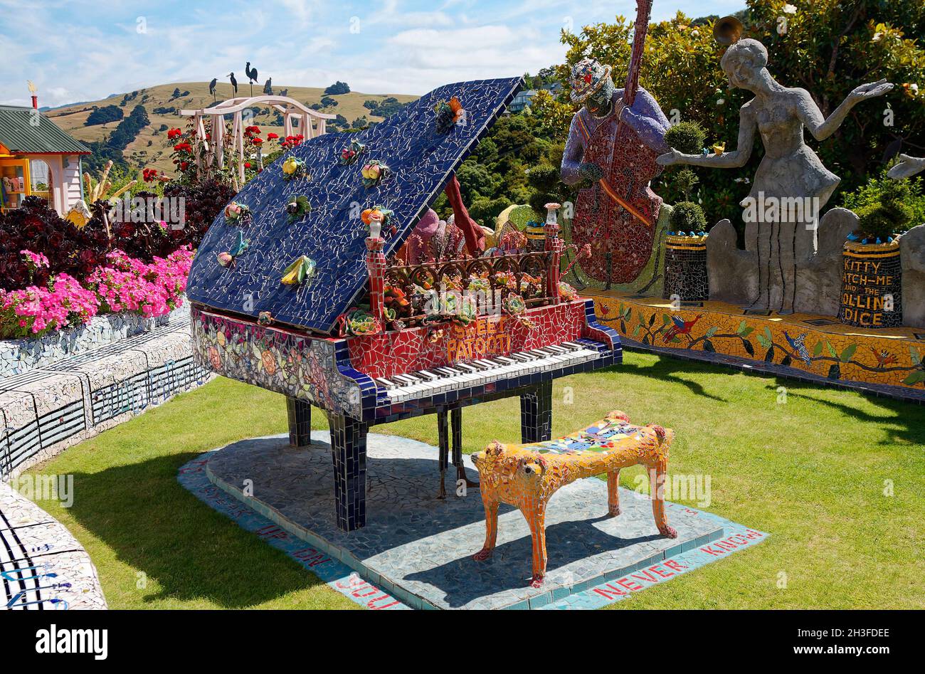 whimsical piano sculpture, colorful mosaics, bass player, curved bench ...