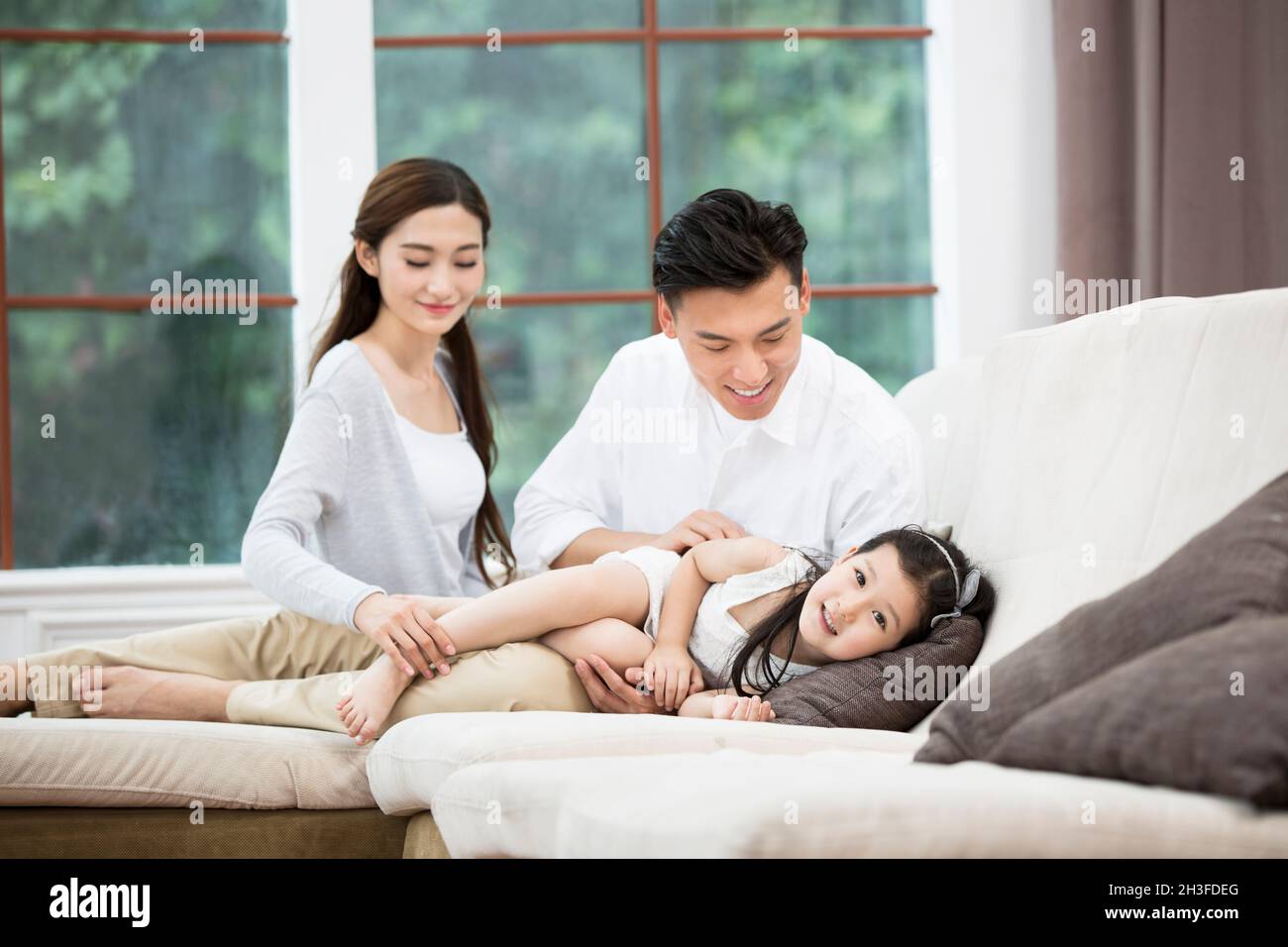 Warm and loving family of three Stock Photo - Alamy