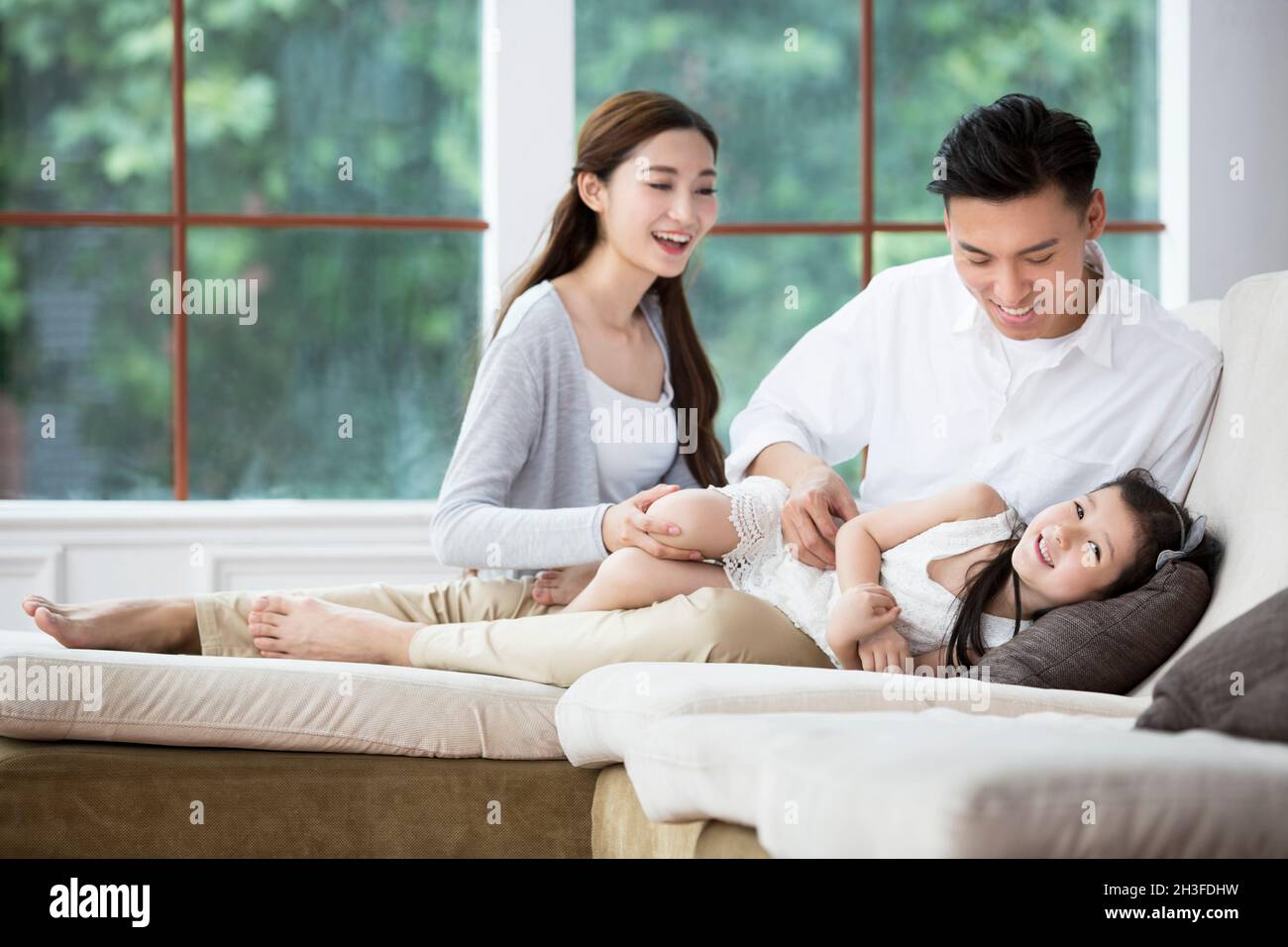 Warm and loving family of three Stock Photo - Alamy