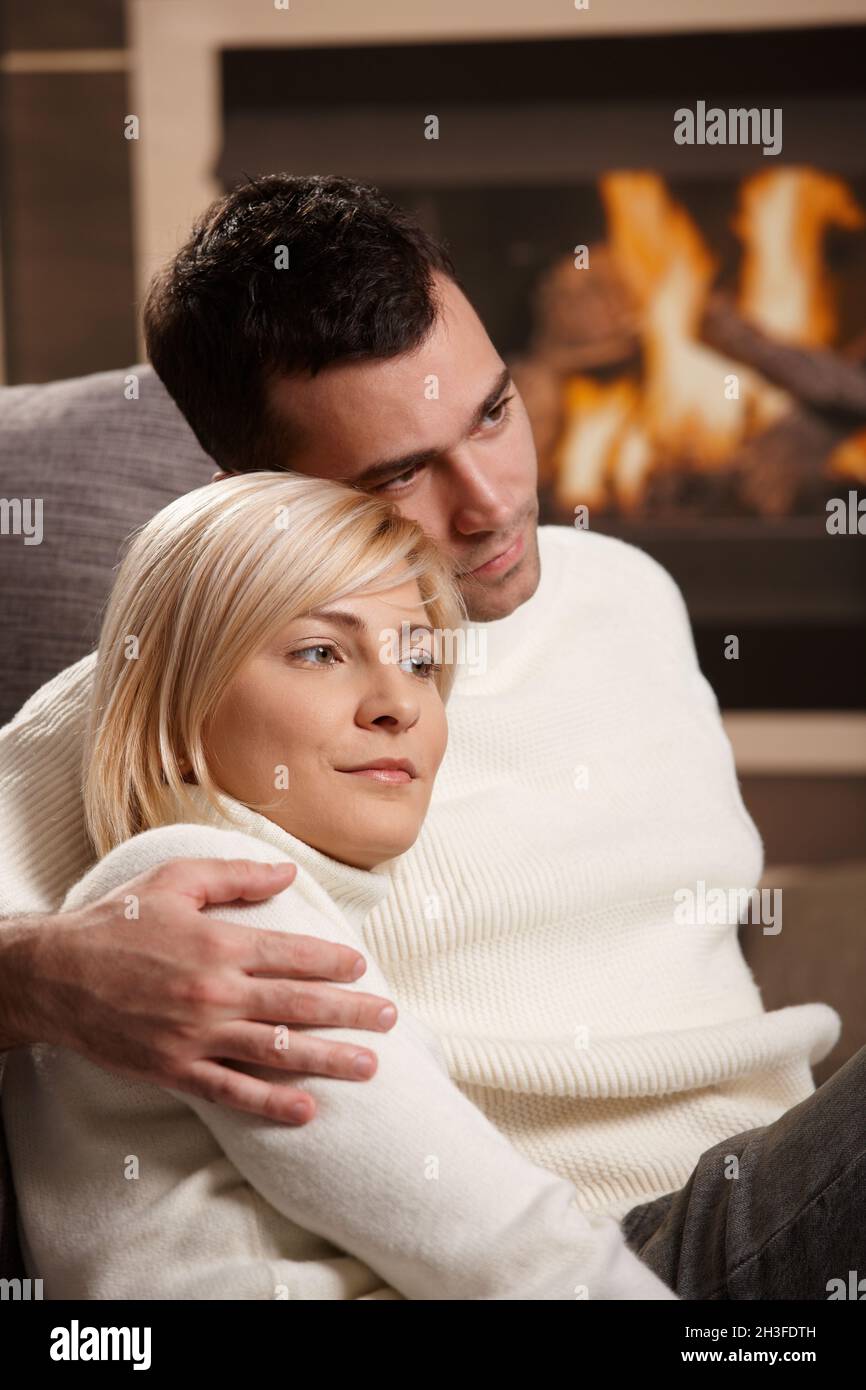 Couple hugging at home Stock Photo - Alamy