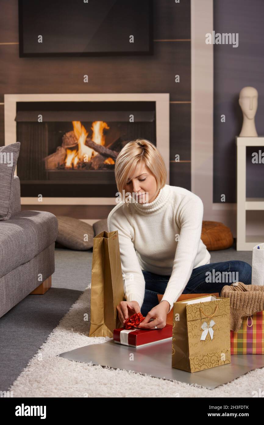 Woman wrapping presents Stock Photo - Alamy