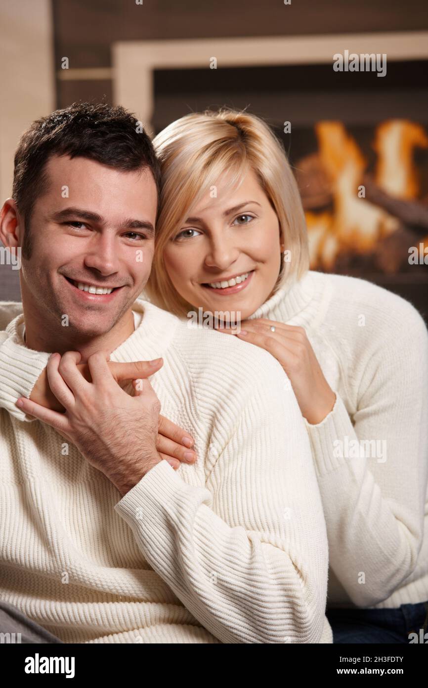 Couple hugging at home Stock Photo - Alamy