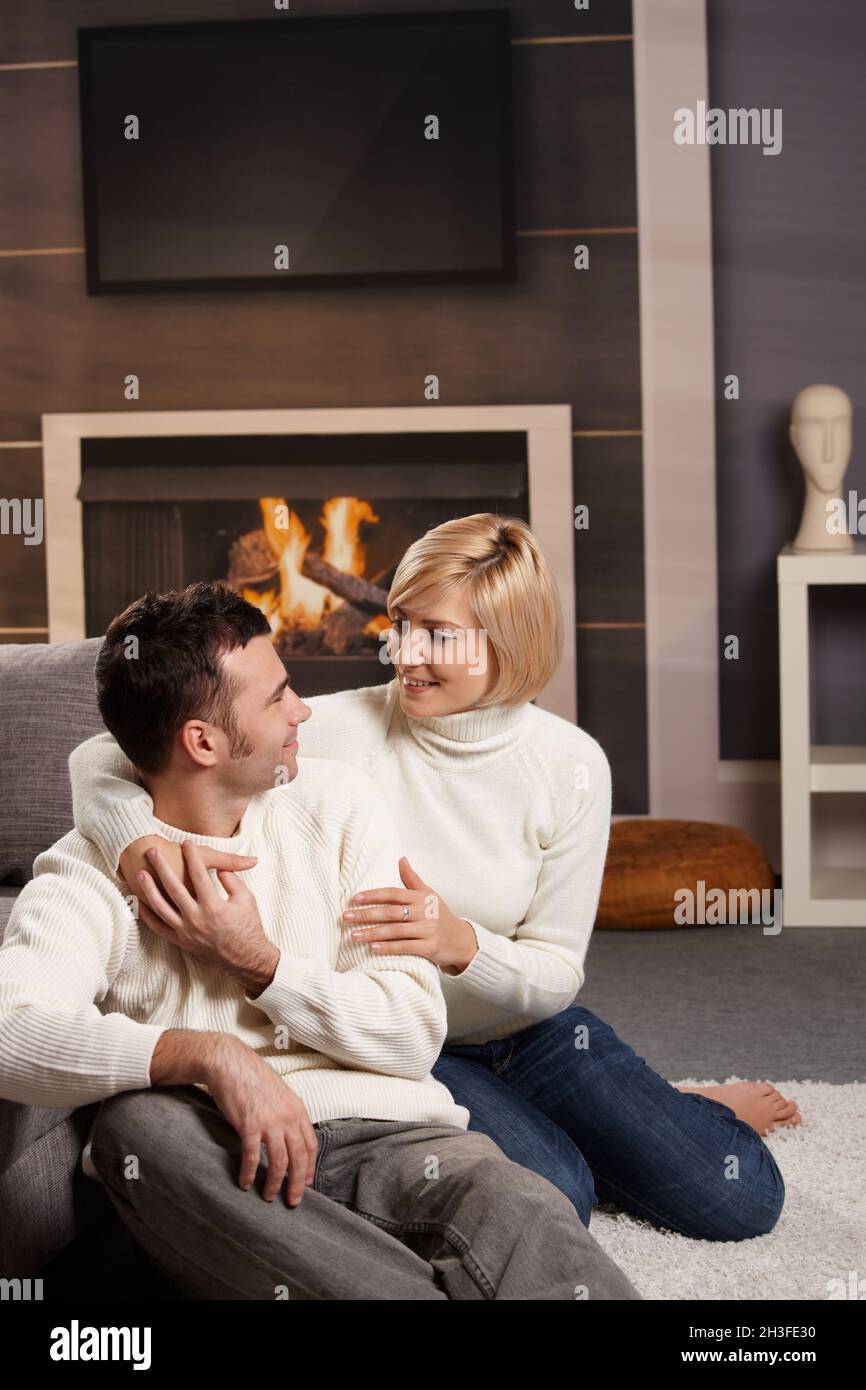Couple hugging at home Stock Photo - Alamy