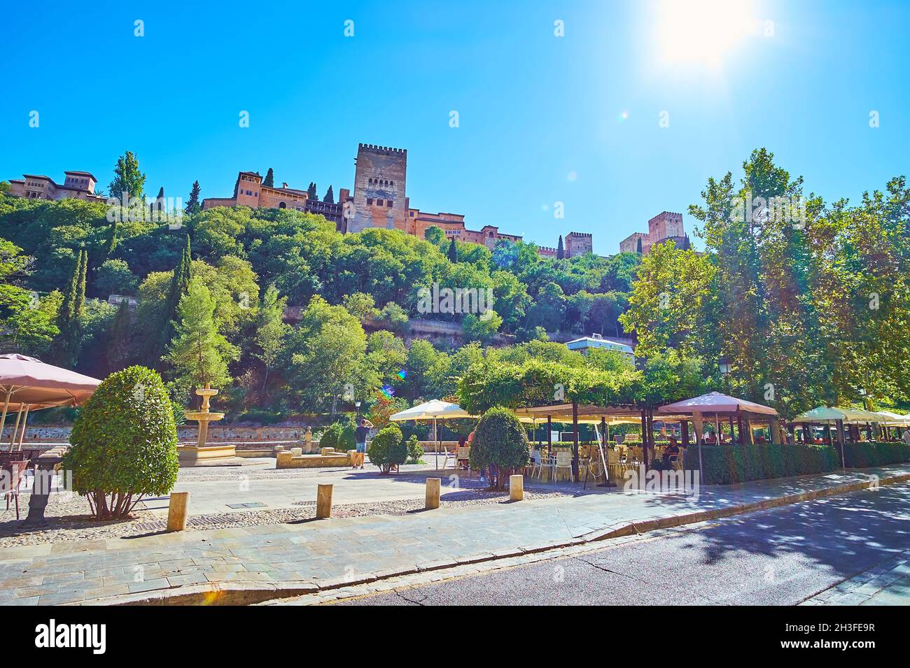 The splendid historic Alhambra Fortress is seen behind the lush ...