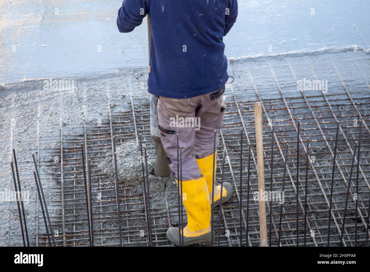 Concreting a base plate with ready-mixed concrete on the construction ...