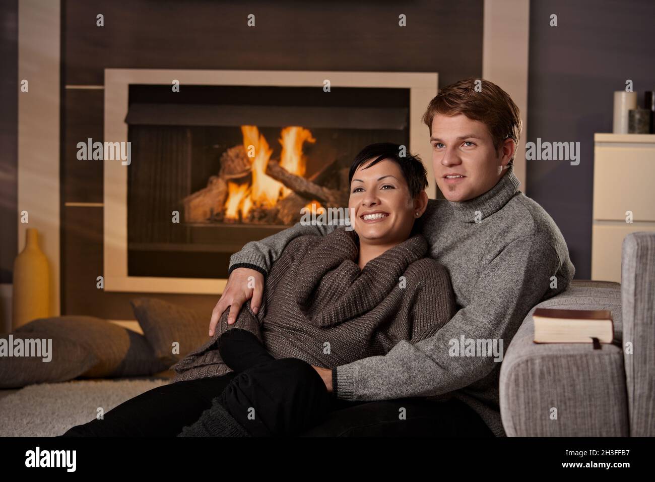 Couple hugging at home Stock Photo - Alamy