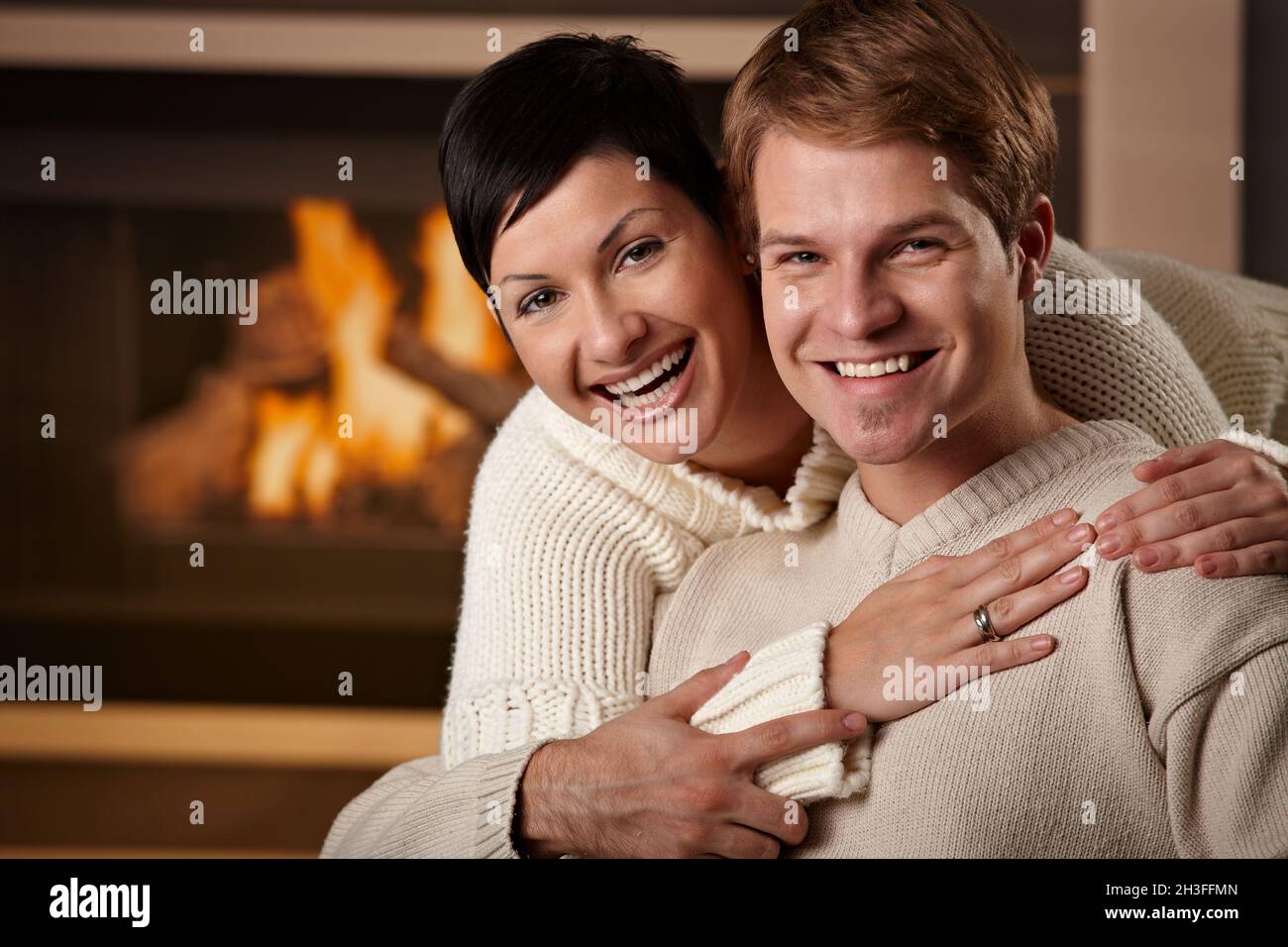 Couple hugging at home Stock Photo - Alamy