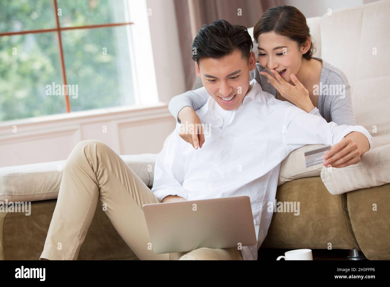 Young couple online shopping hi-res stock photography and images - Alamy