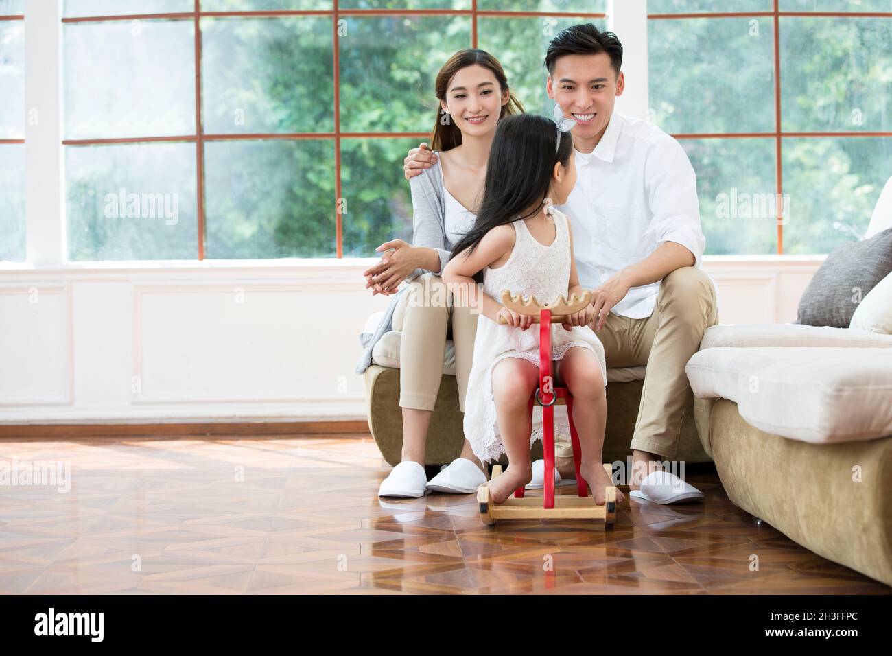 Warm and loving family of three Stock Photo - Alamy
