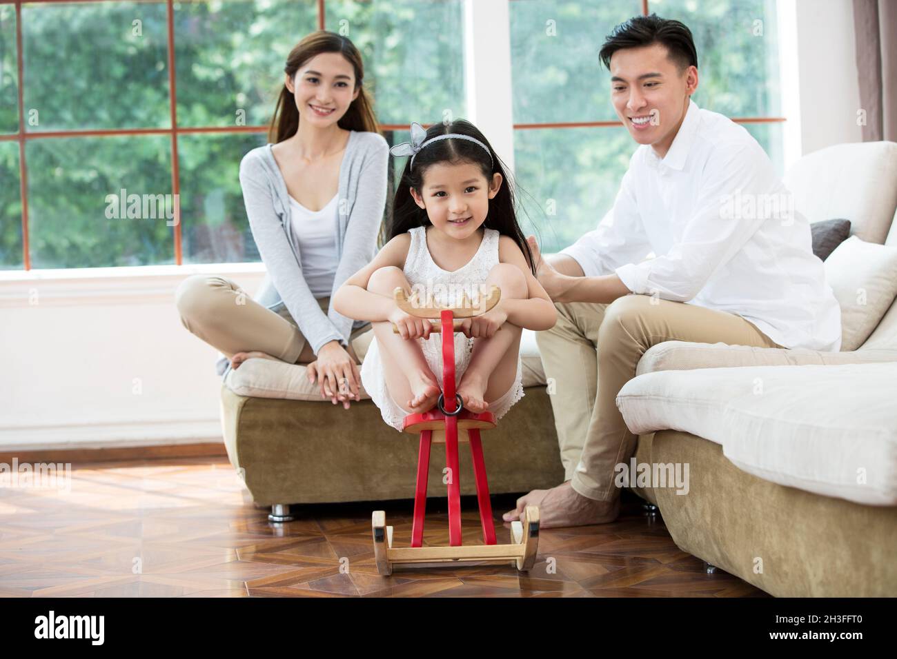 Warm and loving family of three Stock Photo - Alamy