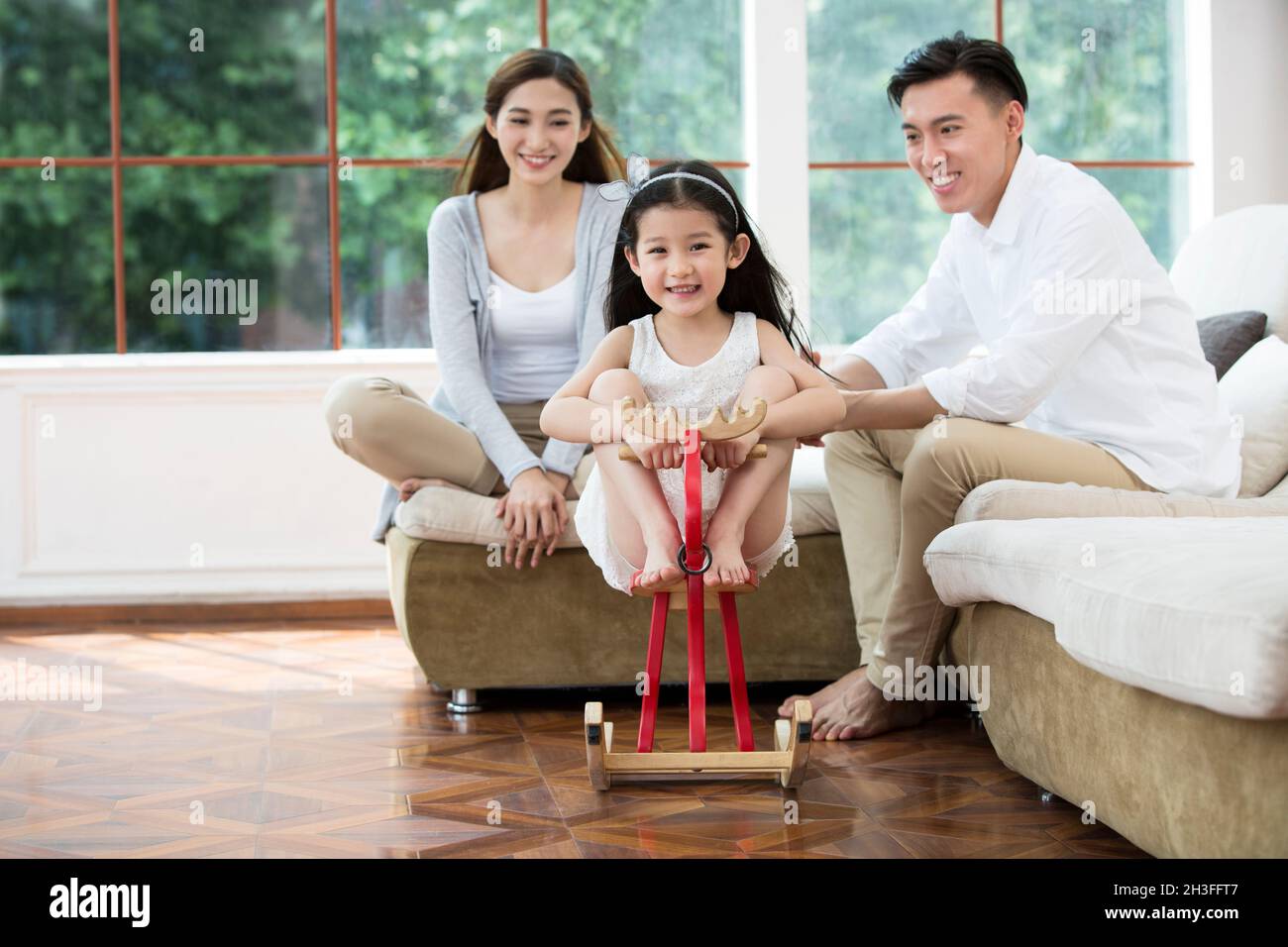 Warm and loving family of three Stock Photo - Alamy