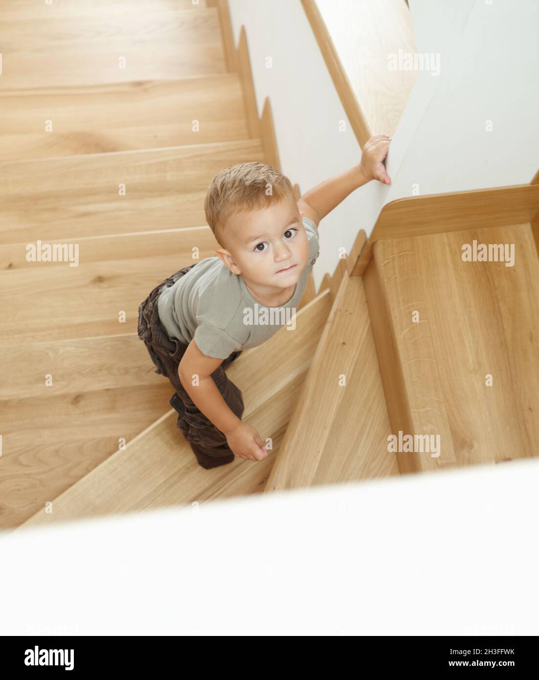 Little boy on stairs Stock Photo - Alamy