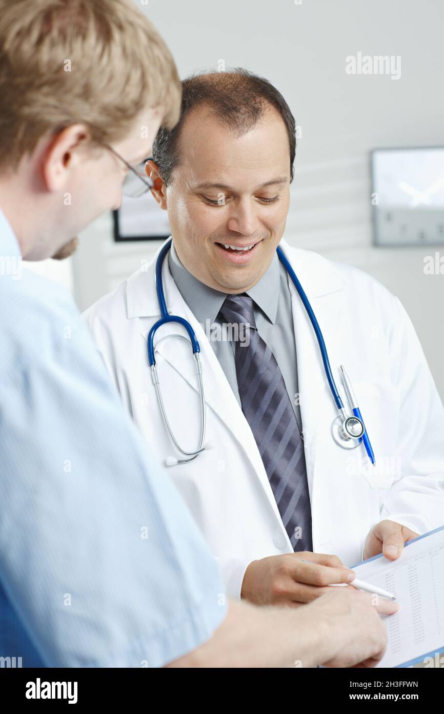 Doctor showing test results Stock Photo - Alamy