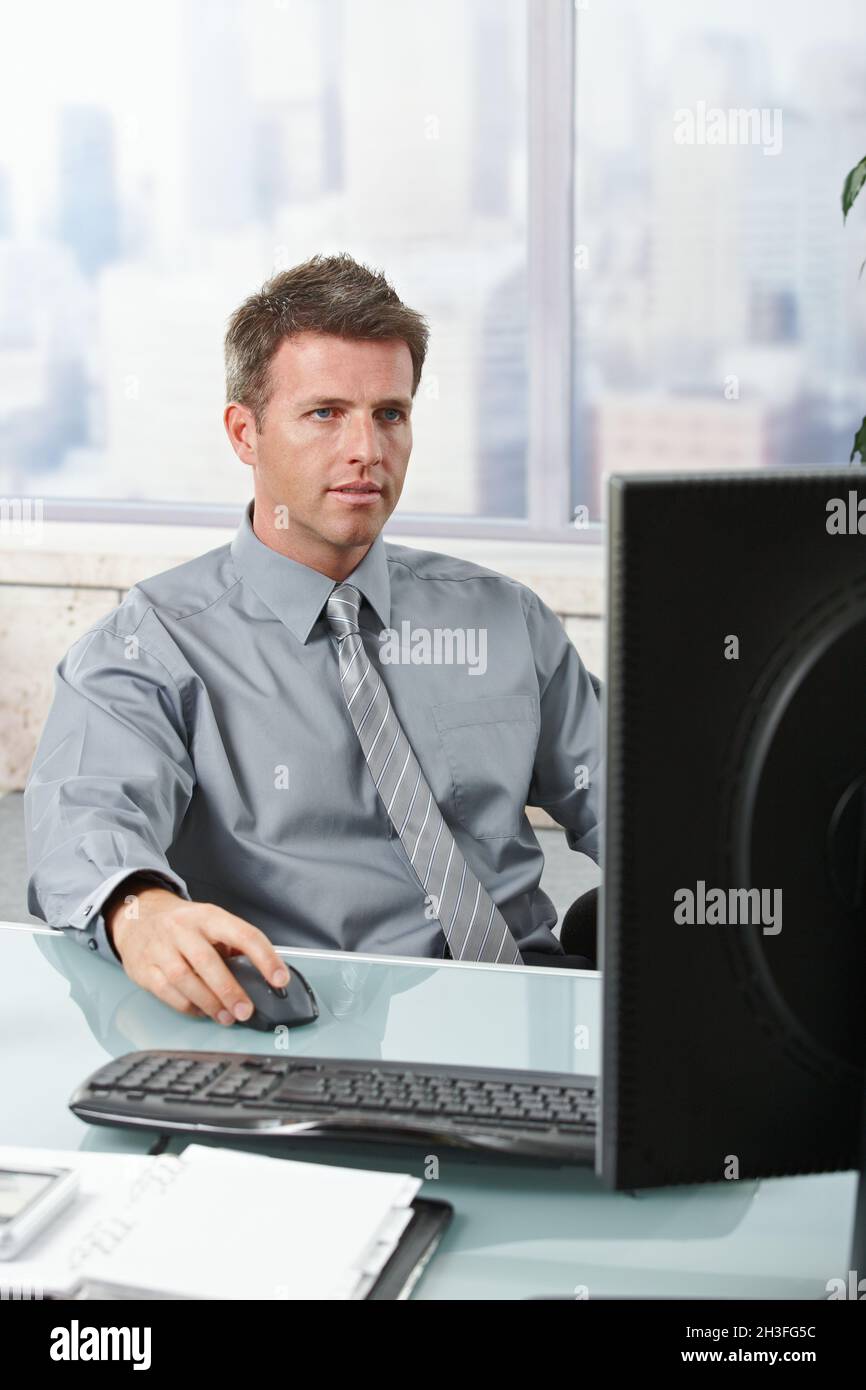 Businessman looking interest computer hi-res stock photography and ...