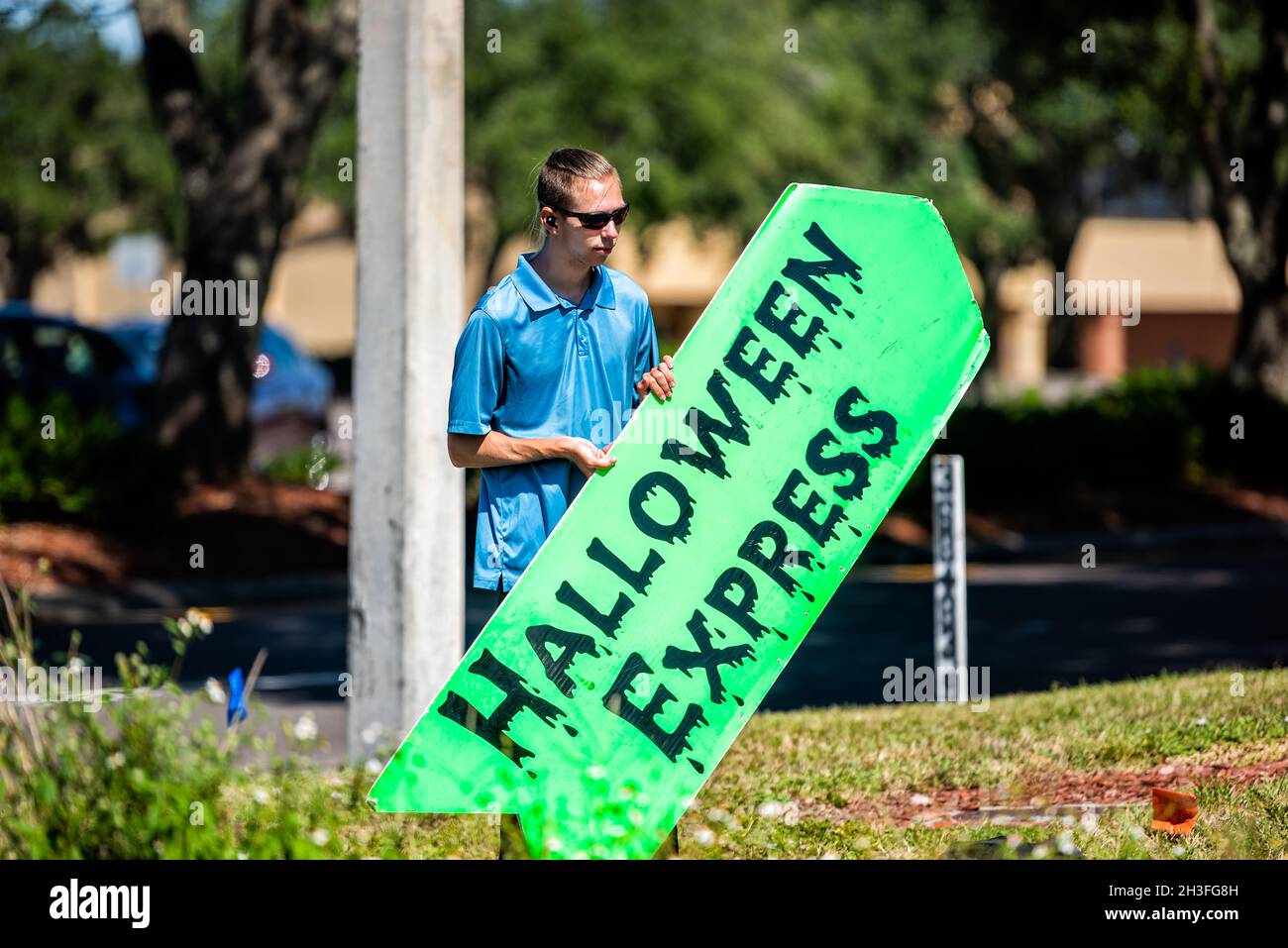 Brandon, USA - October 4, 2021: Man holding sign by road street for ...