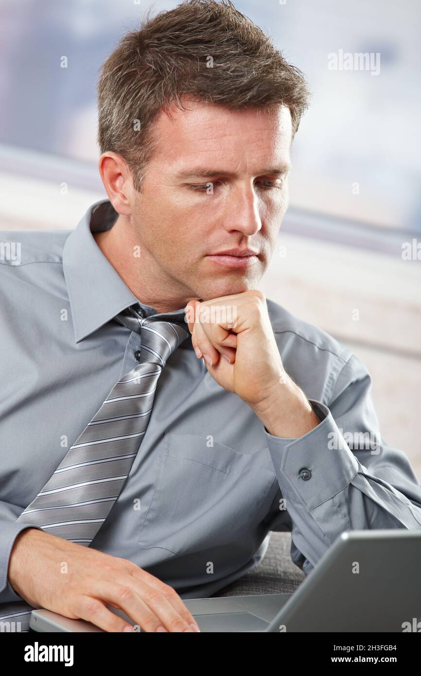 Employee looking down laptop High Resolution Stock Photography and ...