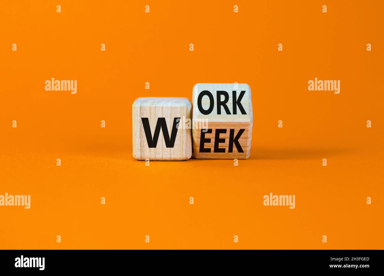 Work week symbol. Turned a wooden cube with words 'Work week ...