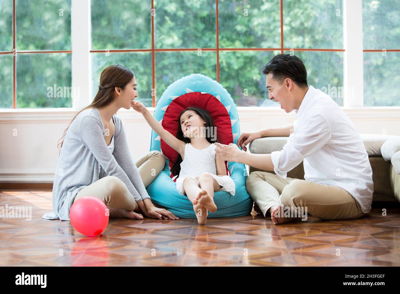 Warm and loving family of three Stock Photo - Alamy