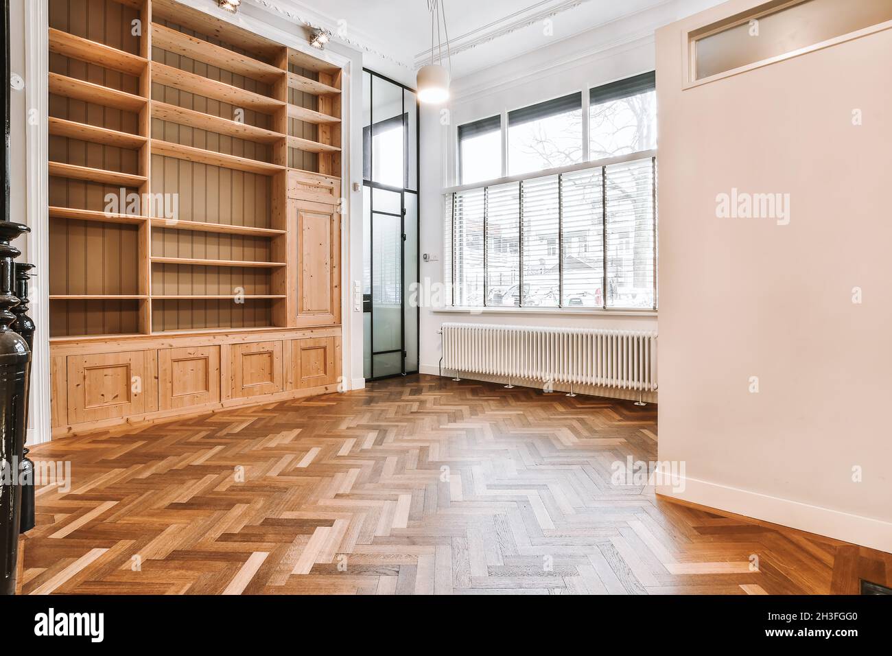 Bright interior of a room with a bookcase Stock Photo - Alamy