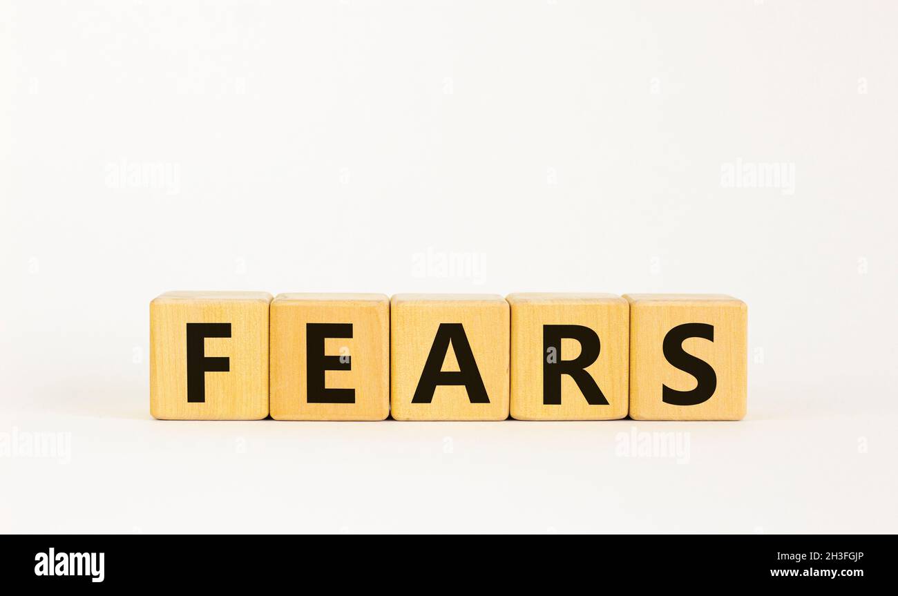 Fears symbol. The concept word 'fears' on wooden cubes. Beautiful white ...