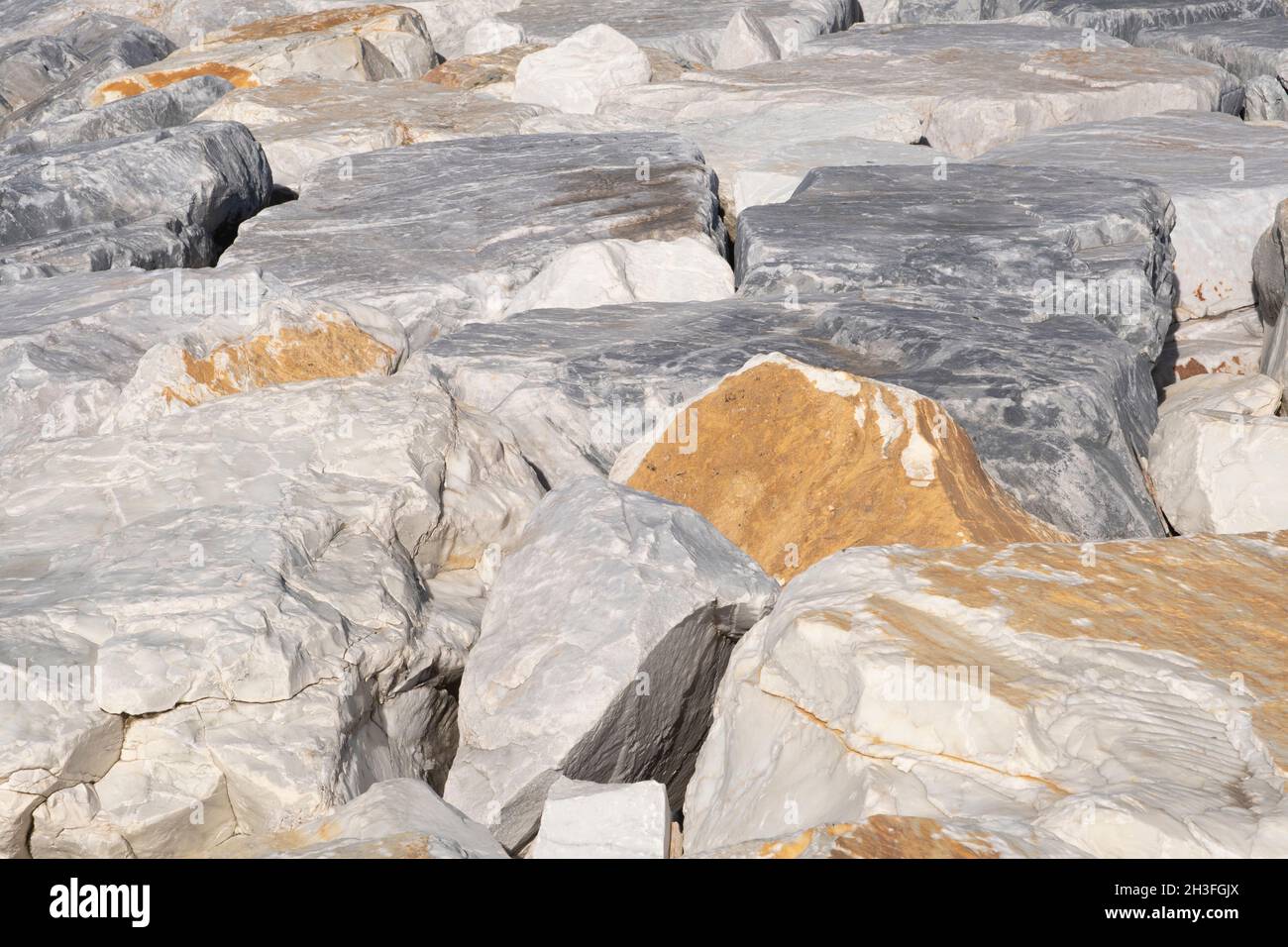 Detail of an artificial cliff made with marble blocks Stock Photo - Alamy