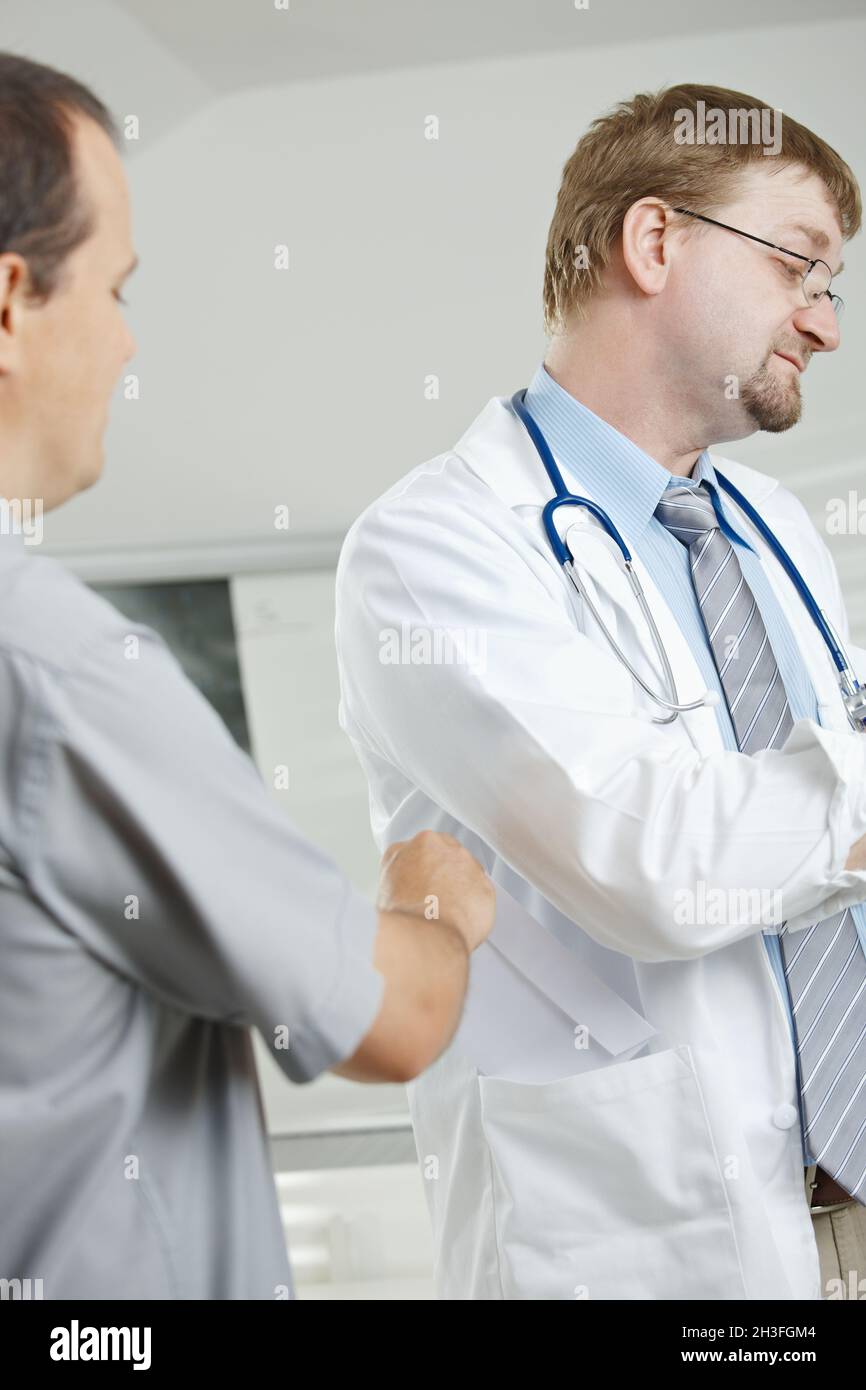 Patient bribing doctor Stock Photo - Alamy