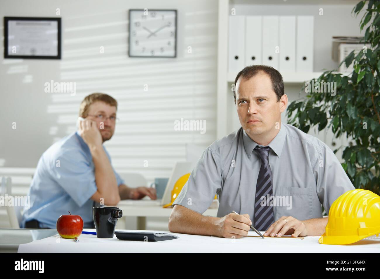 Engineer working at office Stock Photo - Alamy