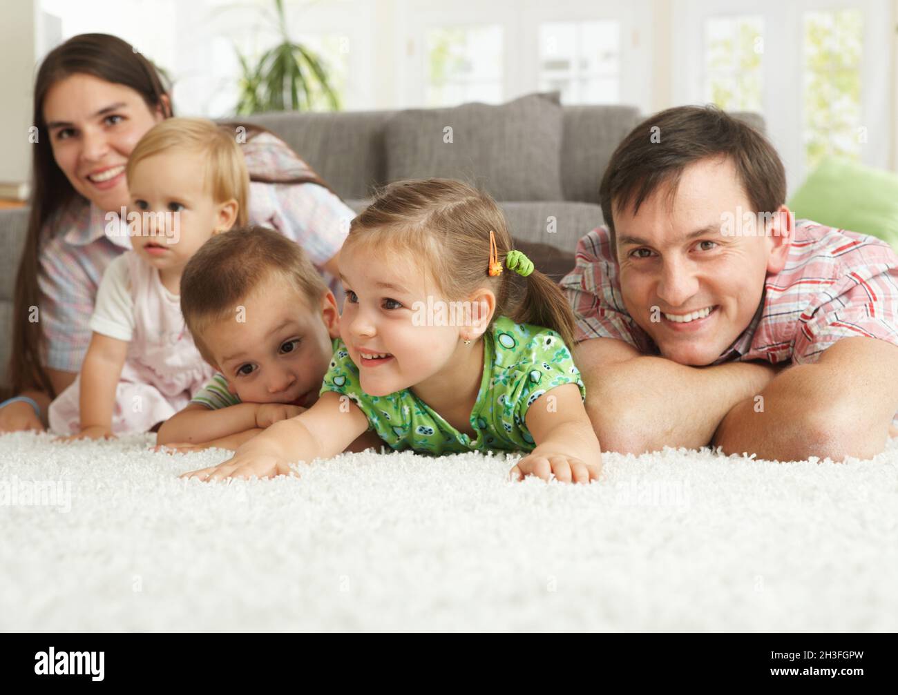 Happy family having fun Stock Photo - Alamy