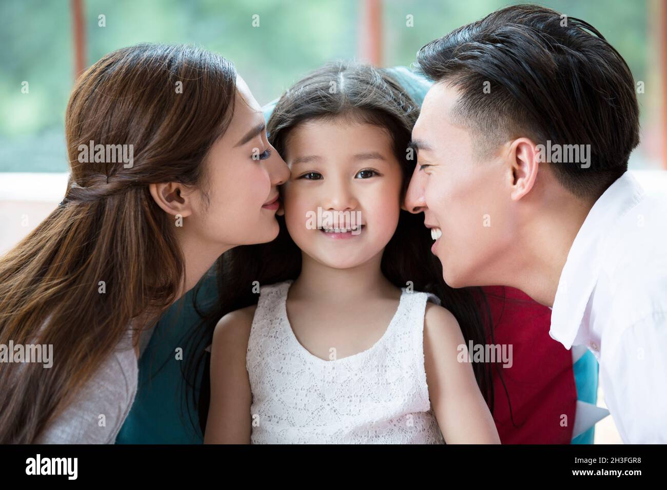 Warm and loving family of three Stock Photo - Alamy
