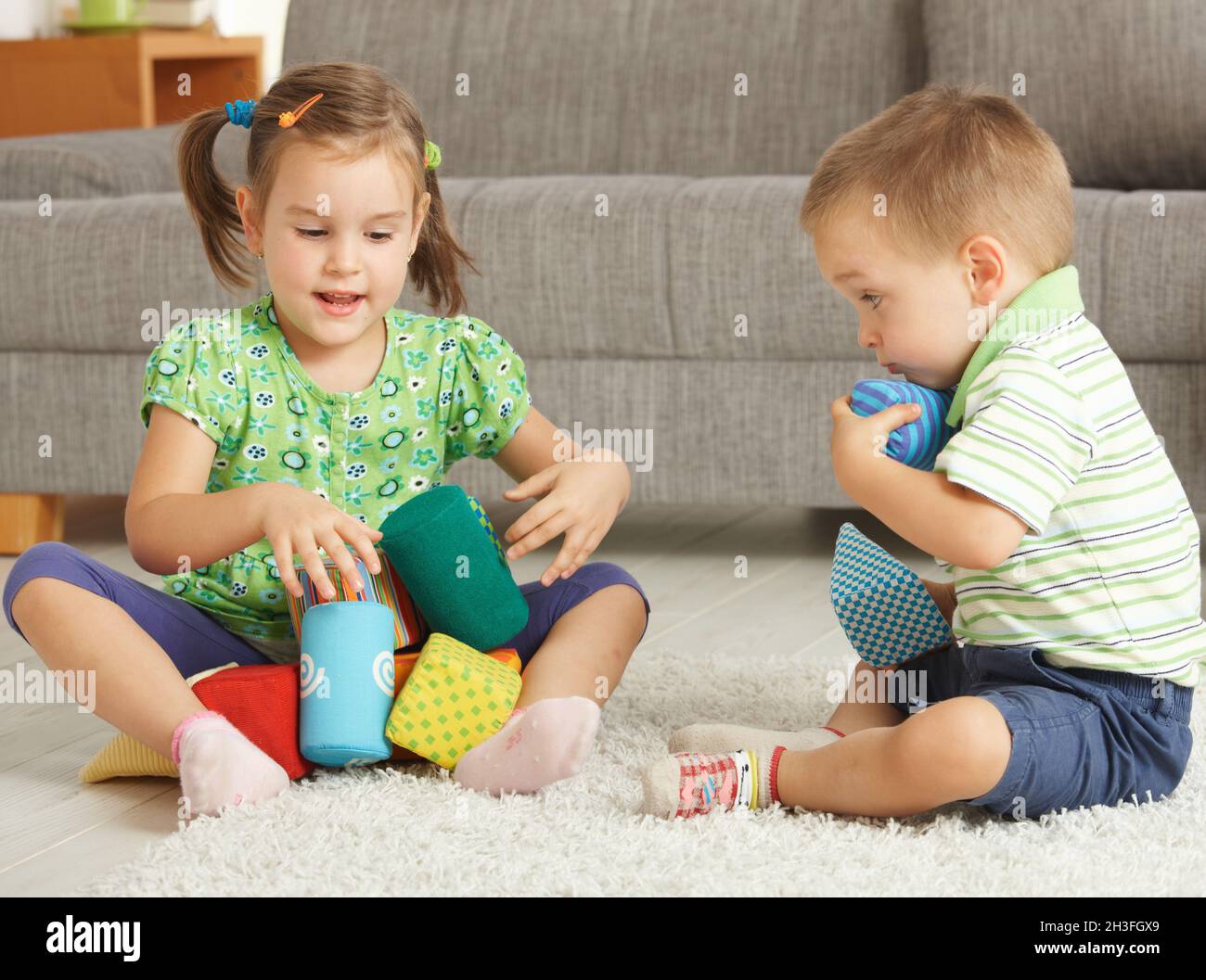 Children playing together at home Stock Photo - Alamy