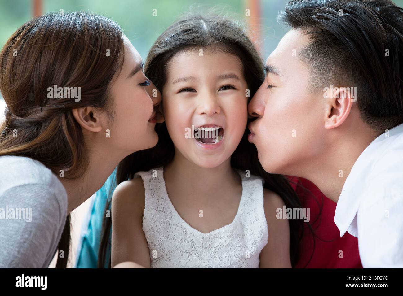 Warm and loving family of three Stock Photo - Alamy