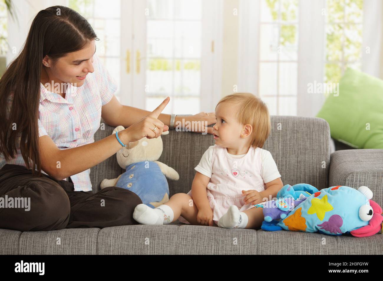 Mother teaching babygirl Stock Photo - Alamy