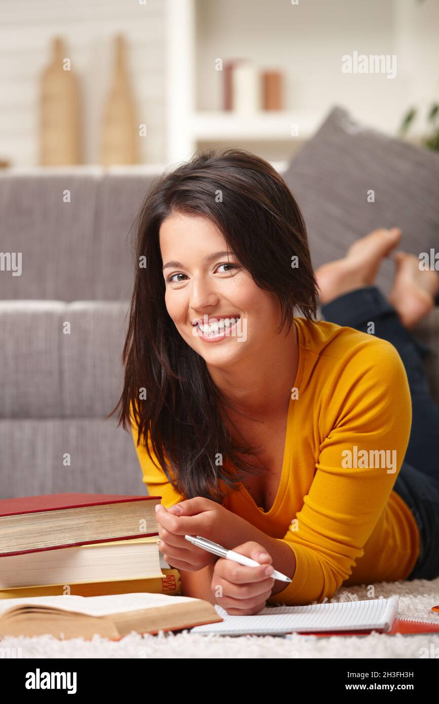Happy student girl smiling at camera Stock Photo - Alamy