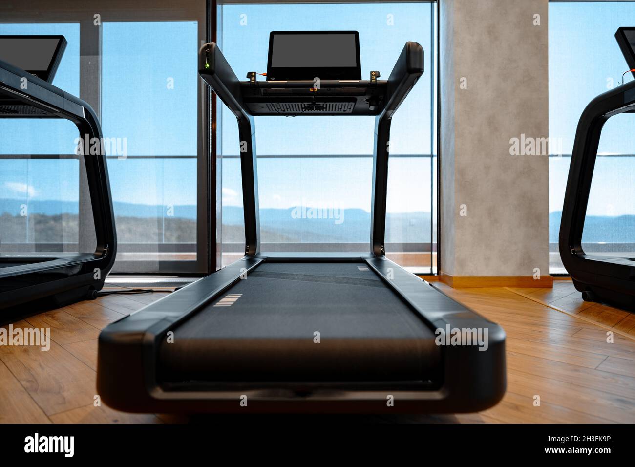 Studio shot of a professional treadmill in modern gym Stock Photo - Alamy