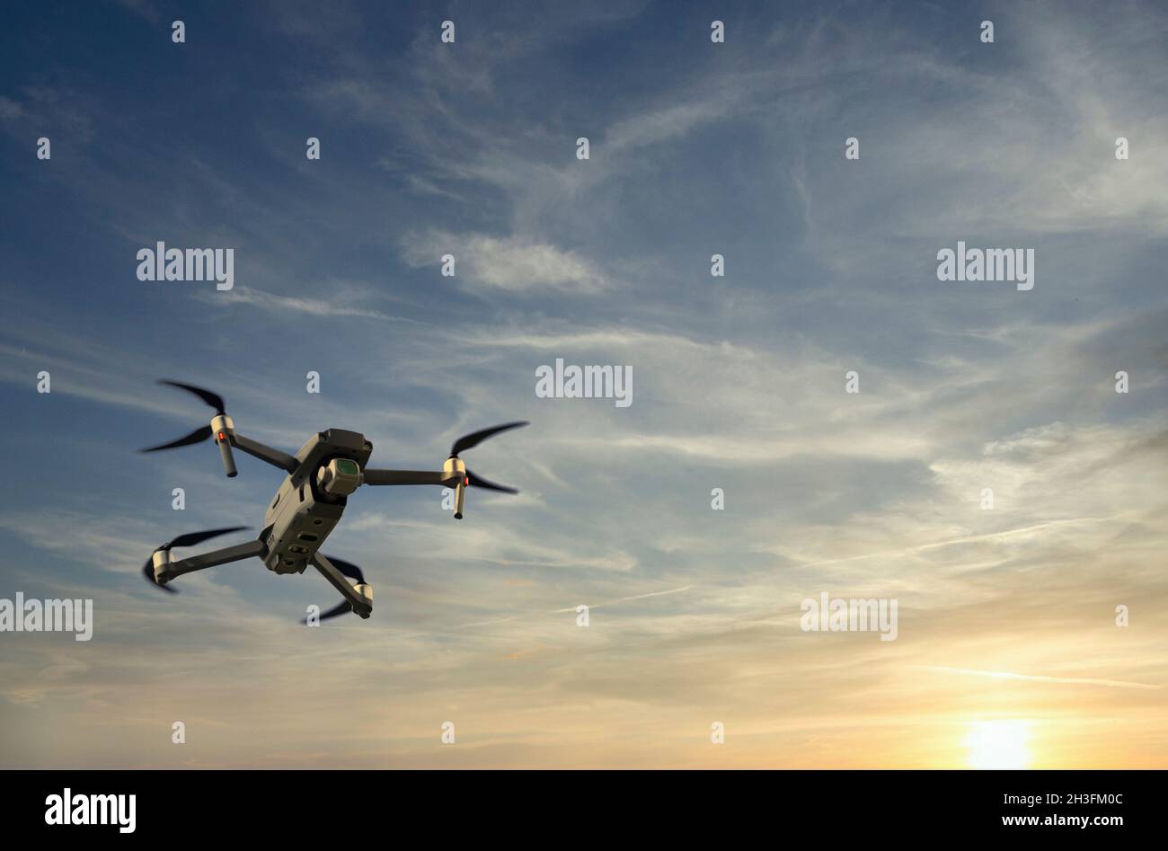 Drone flying at night against dark sky Stock Photo - Alamy