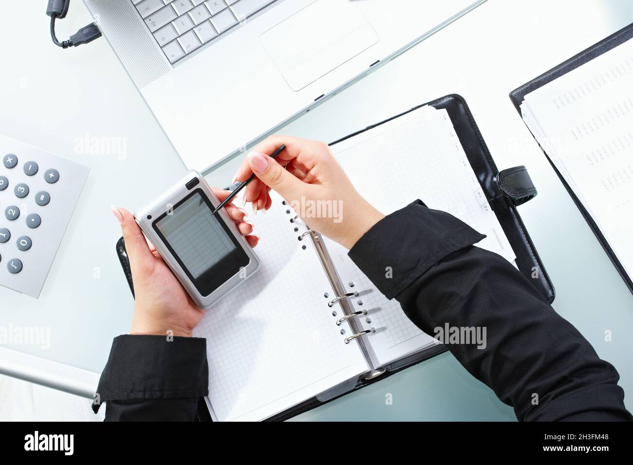 Female hand using PDA Stock Photo - Alamy