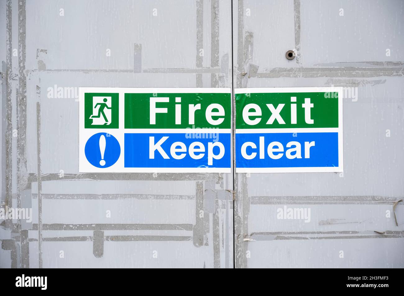 Fire exit keep clear sign on construction building site door Stock ...