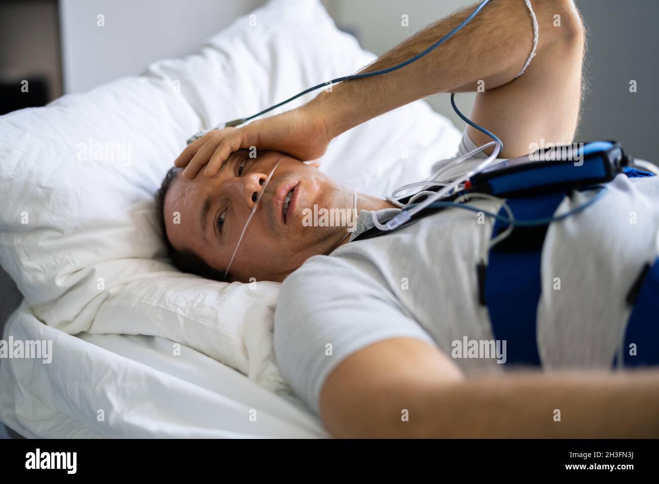 Disturbed Sleep In Bedroom. Awake Man With Insomnia Stock Photo - Alamy