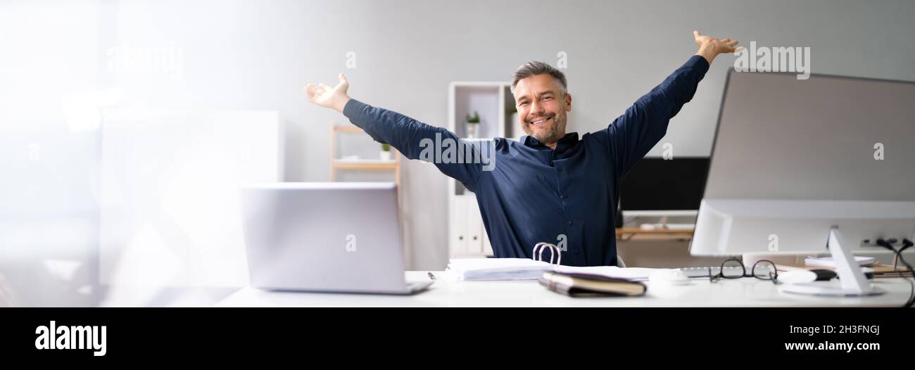 Work From Home Stretch Exercise At Computer Desk Stock Photo - Alamy
