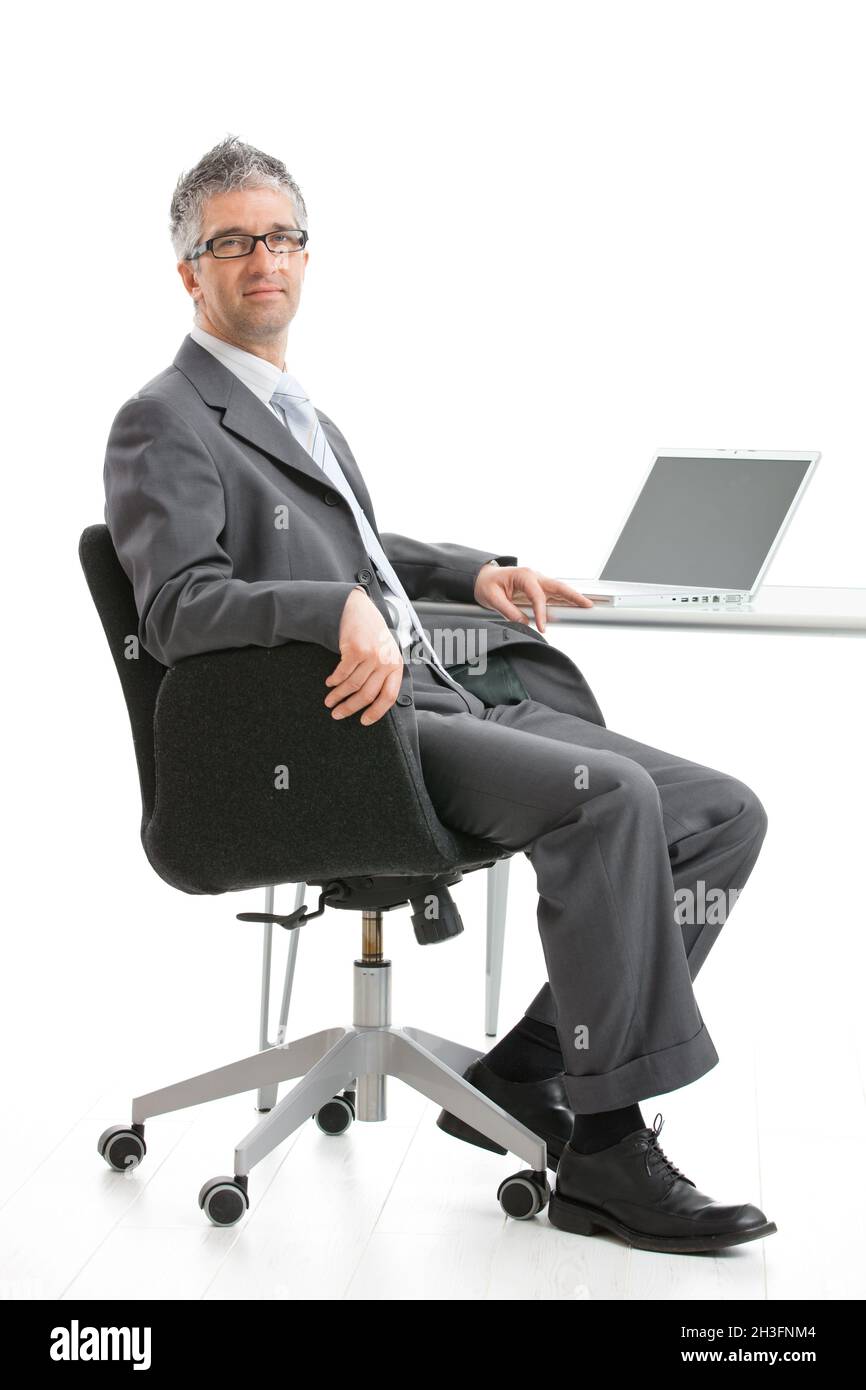 Person sitting at desk Cut Out Stock Images & Pictures - Alamy
