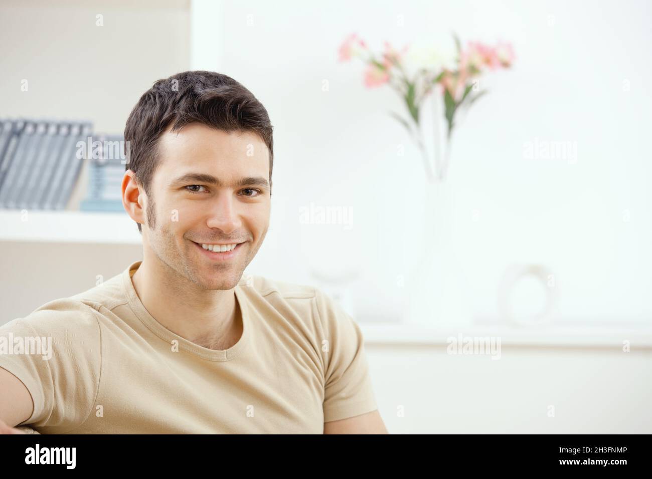 Young man at home Stock Photo - Alamy