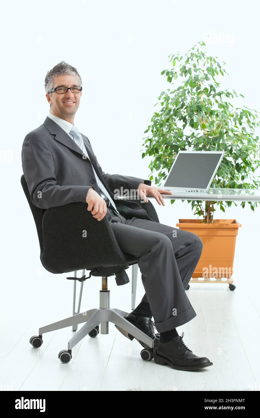 Corporate professional sitting desk hi-res stock photography and images ...