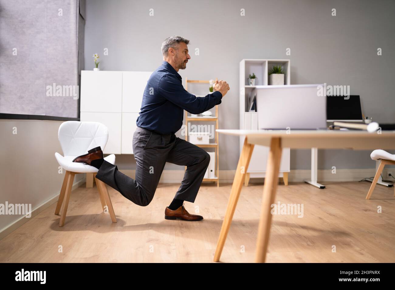 Standing Office Yoga Workout And Workout Near Business Computer Stock ...