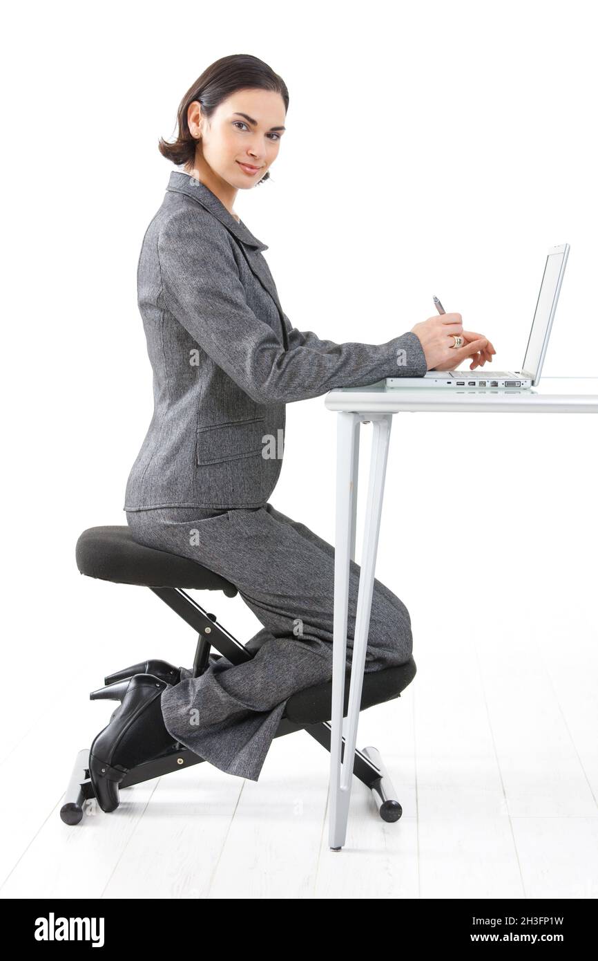 Kneeling chair woman laptop hi-res stock photography and images - Alamy