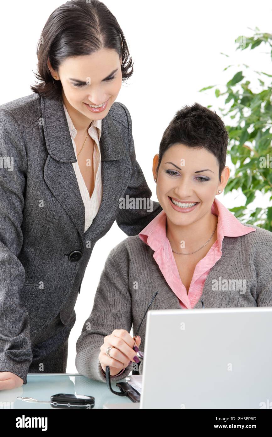 Businesswomen working at desk Stock Photo - Alamy