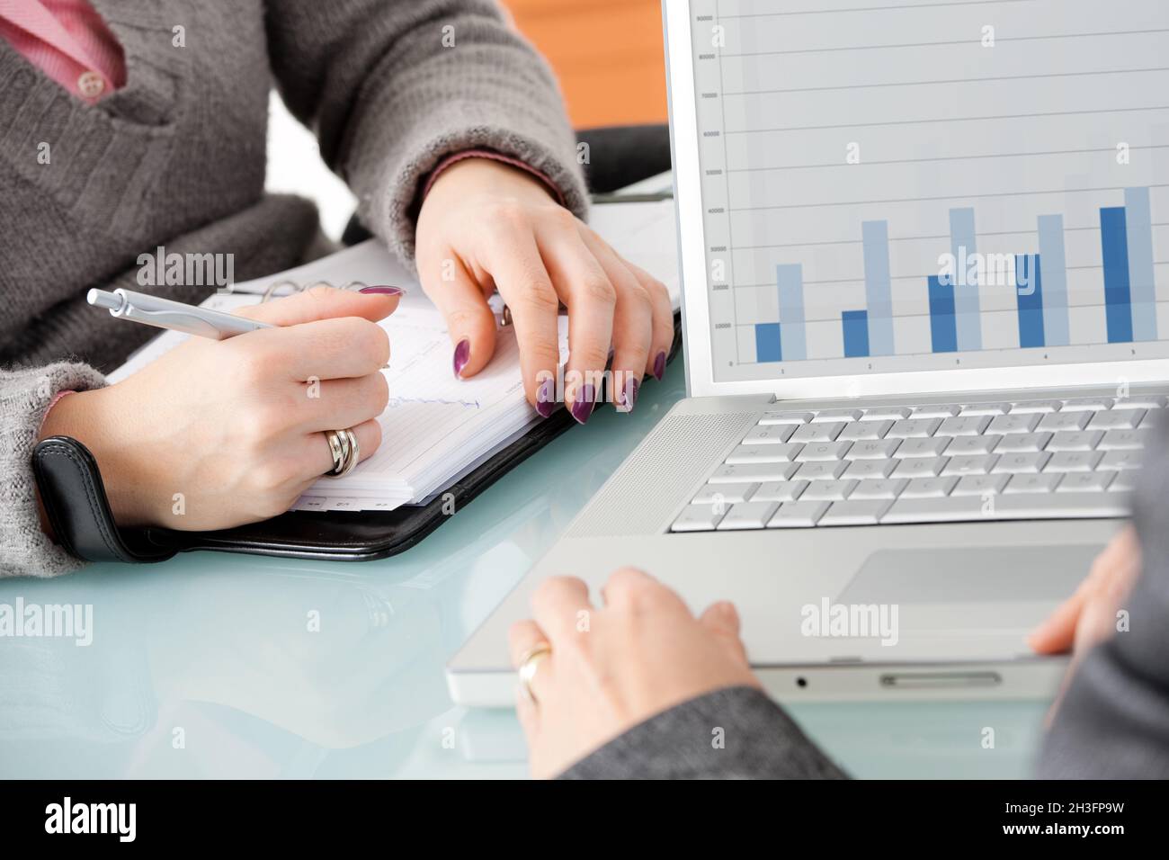 Female hands using laptop Stock Photo - Alamy